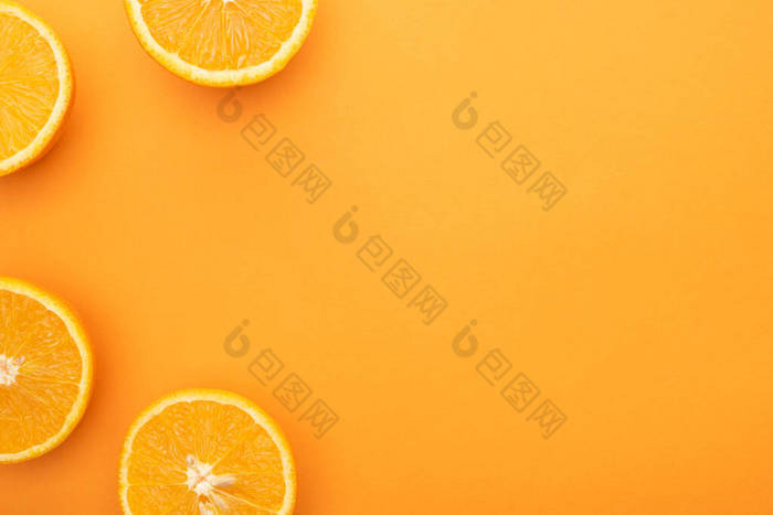 带有复制空间的彩色背景成熟多汁橙片的顶部-包图企业站